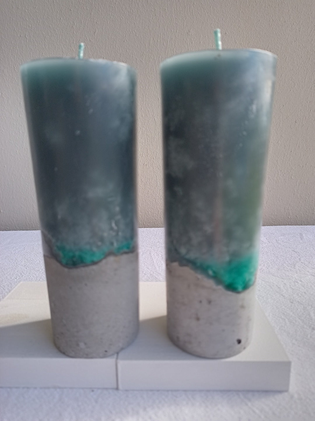 Multi coloured pillar candles with various scents – Curious Candle Co.